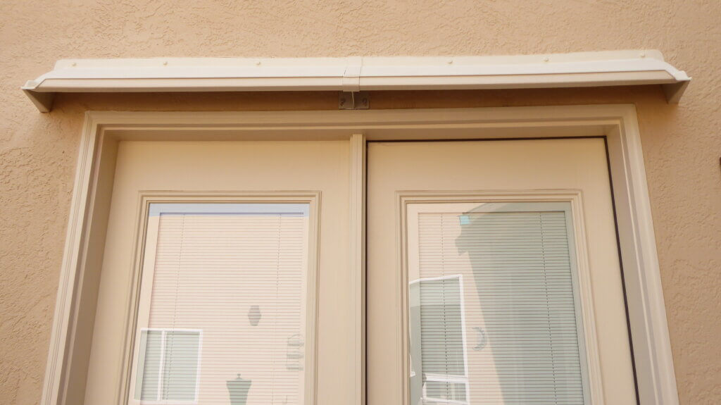 Over door or window rain shield stops leaks and drips.