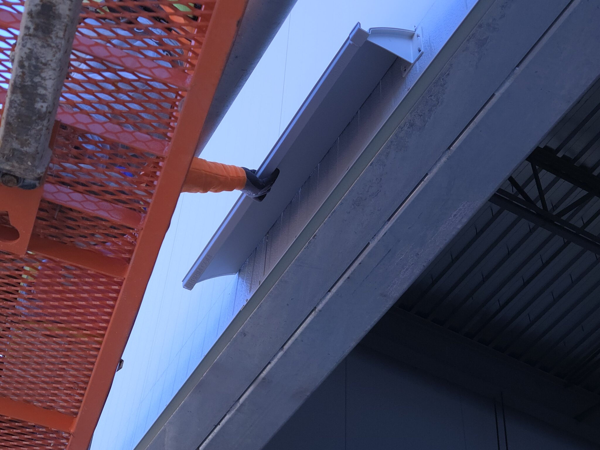 Steel building door or window visor or flashing stops leaks.